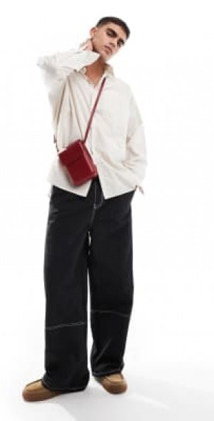 ASOS DESIGN - baggy pants in black nylon with contrast stitch