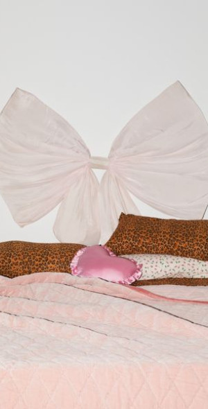 Urban Outfitters - Bow Upholstered Floating Headboard in Pink at